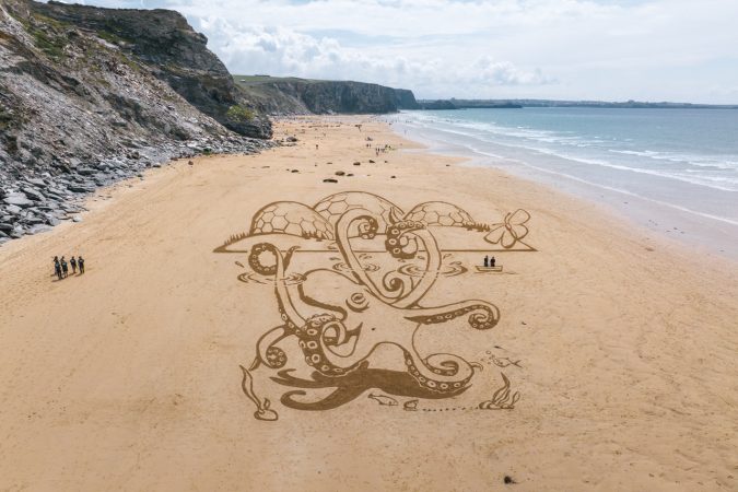Sand drawing in Cornwall with Eden Project